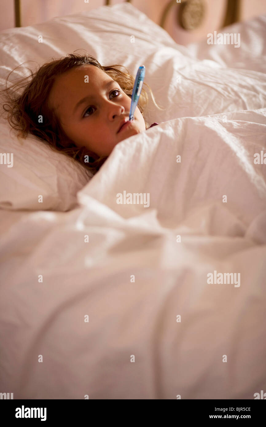 Sick child in bed Stock Photo - Alamy