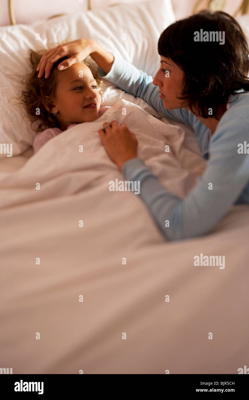 Mother with sick child Stock Photo - Alamy