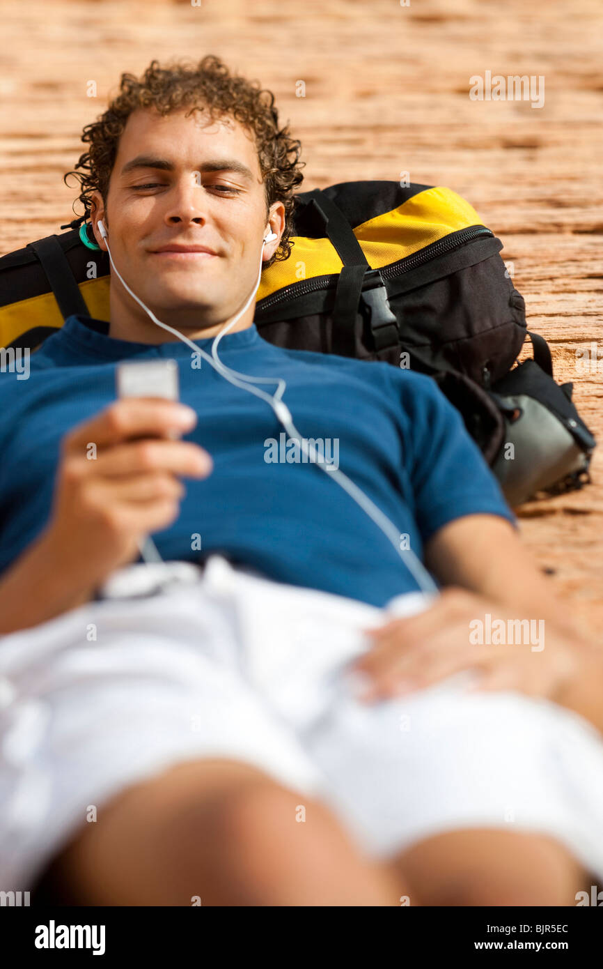 Man listening to MP3 player Stock Photo - Alamy