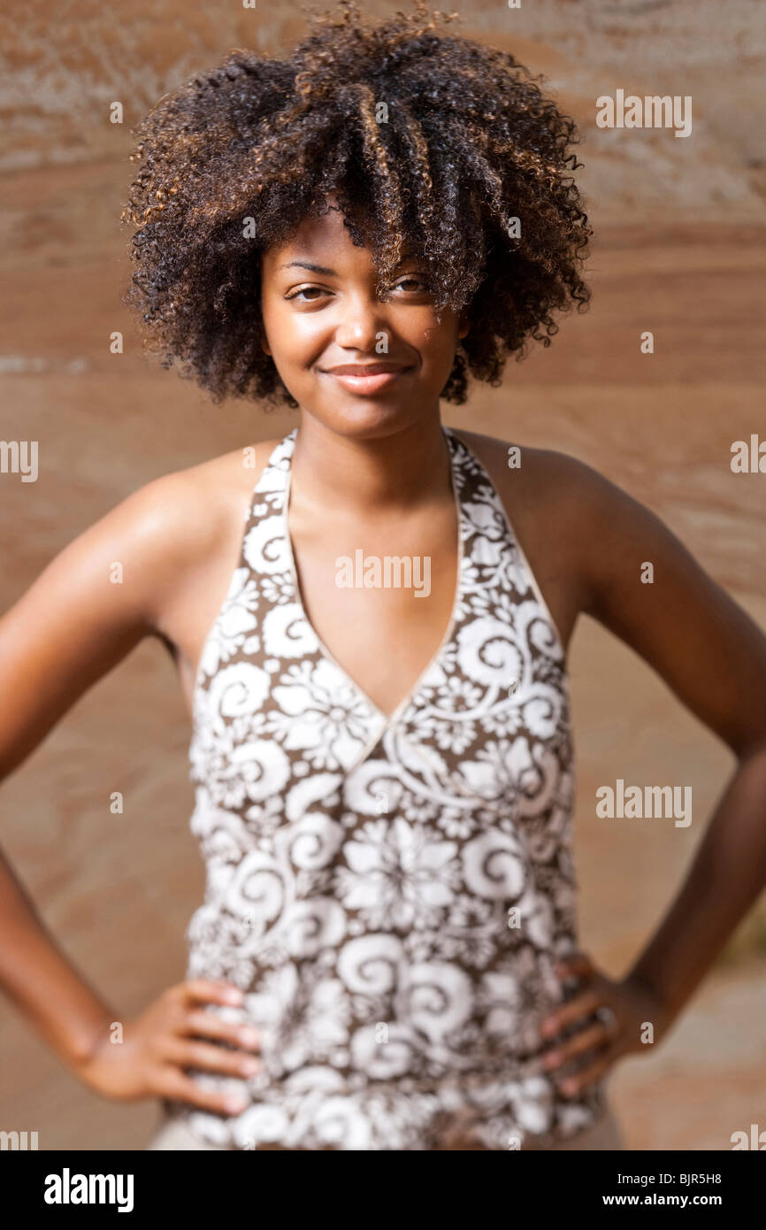 Woman in white patterned top Stock Photo - Alamy