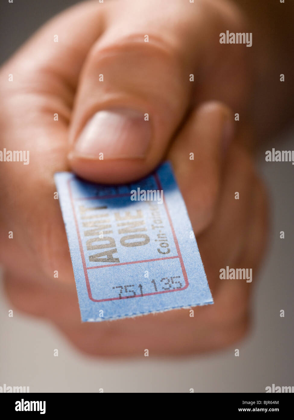 hand holding a ticket Stock Photo - Alamy