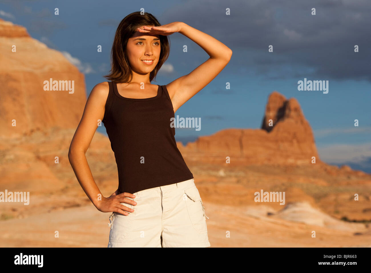 Smiling woman in shorts Stock Photo - Alamy