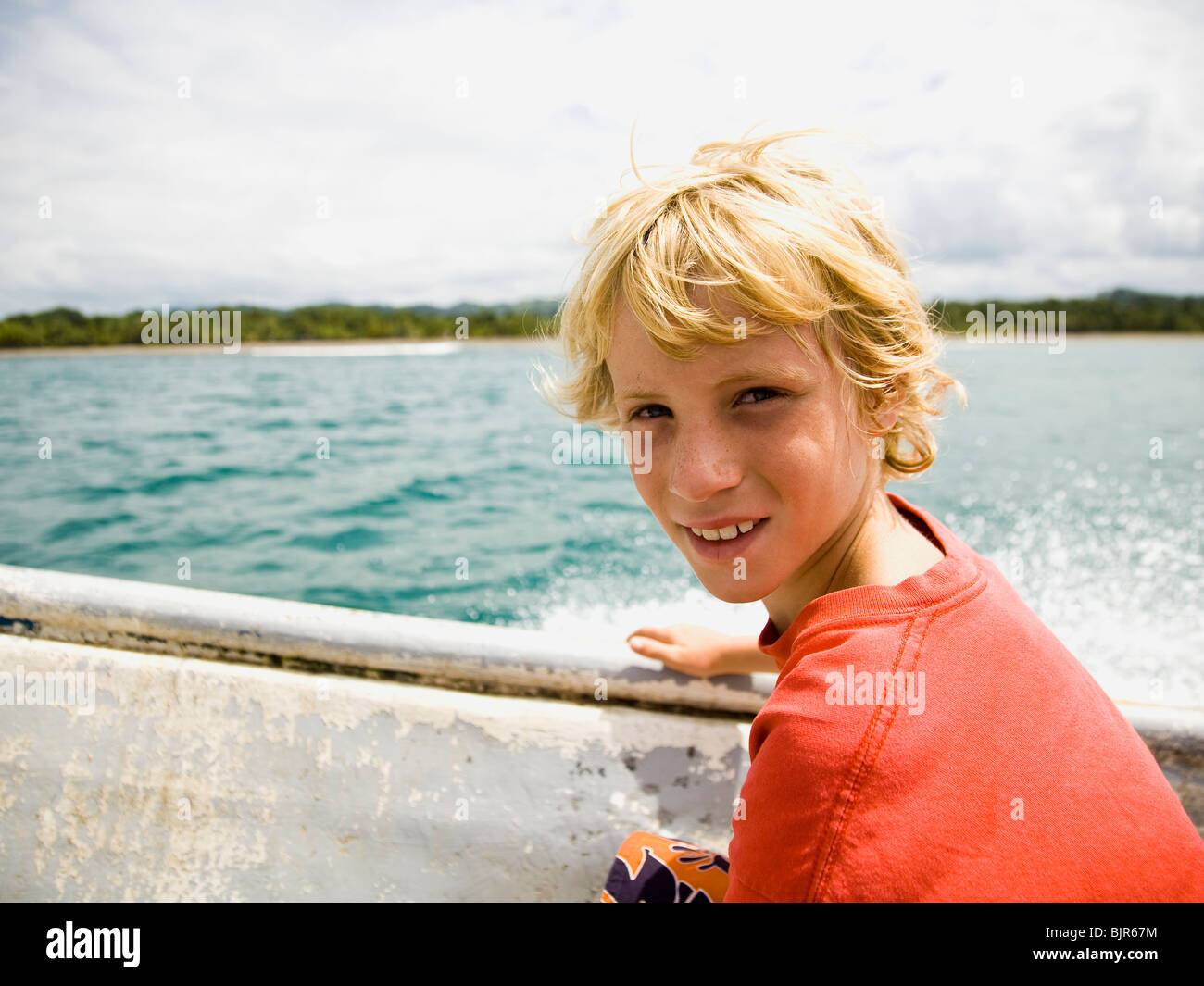boy on a boat Stock Photo - Alamy