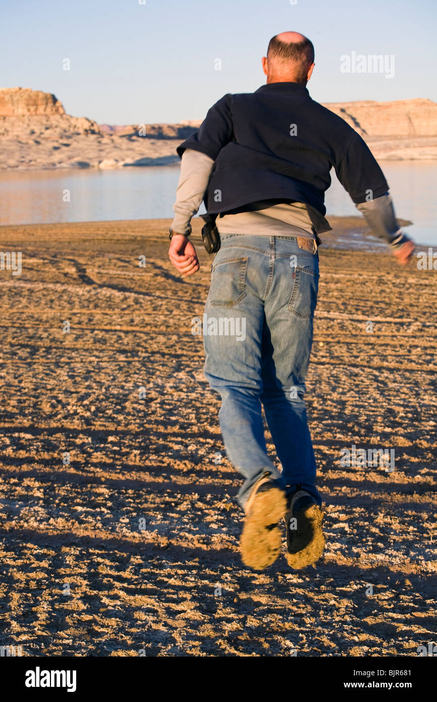 Man jumping for joy at Lake Powell, Utah Stock Photo - Alamy