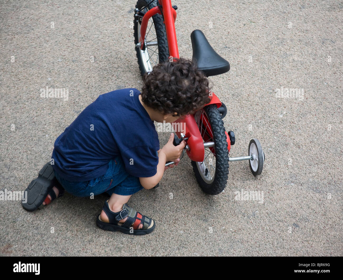 boy fixing his bike Stock Photo - Alamy