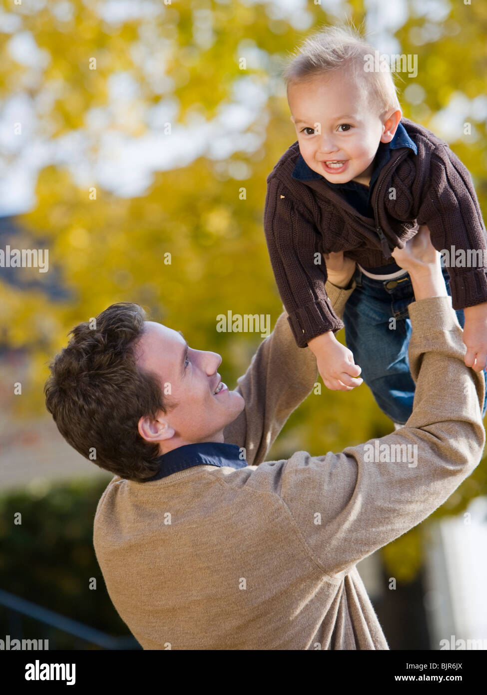 Father lifting baby in air hi-res stock photography and images - Alamy