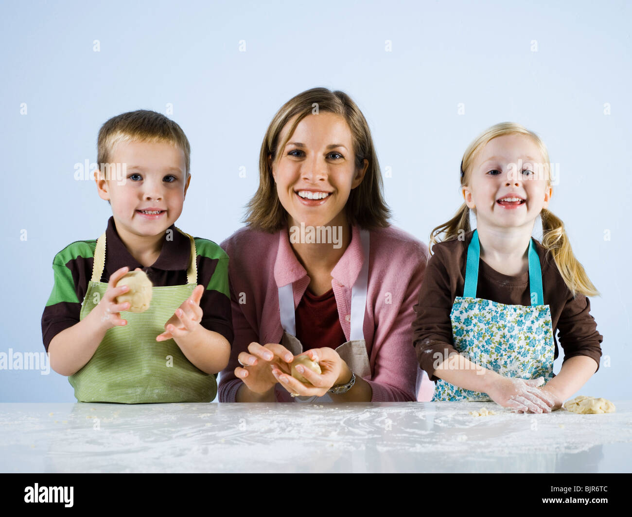 mother cooking with children Stock Photo - Alamy