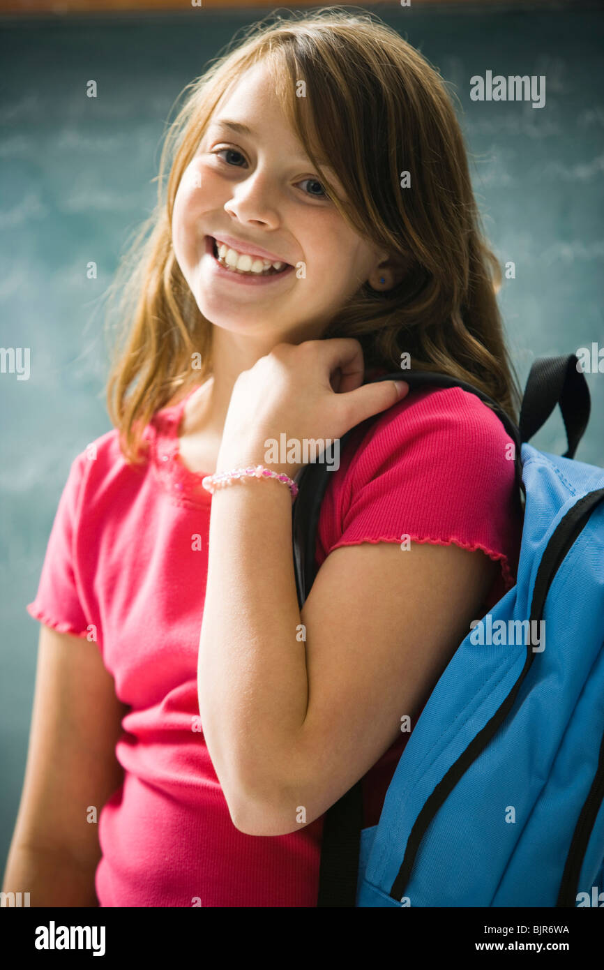 Girl alone in classroom sad hi-res stock photography and images - Alamy