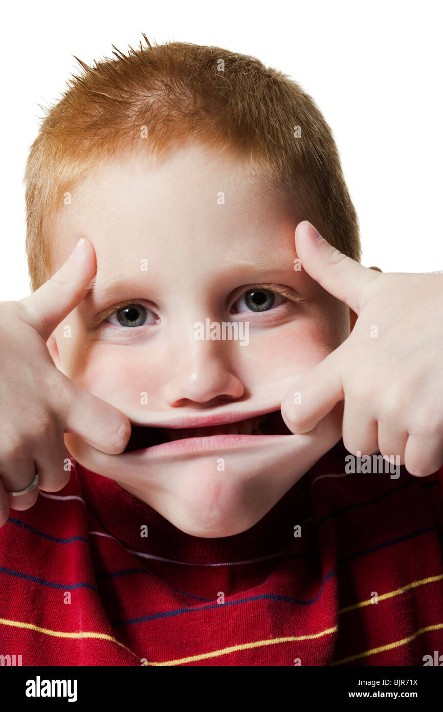 Boy pulling funny face Stock Photo - Alamy