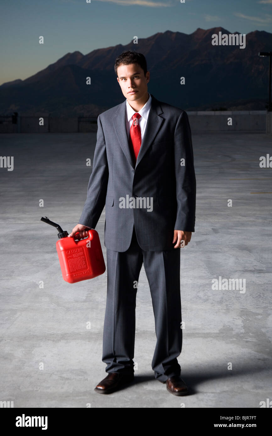 man in a suit with a gas can Stock Photo - Alamy