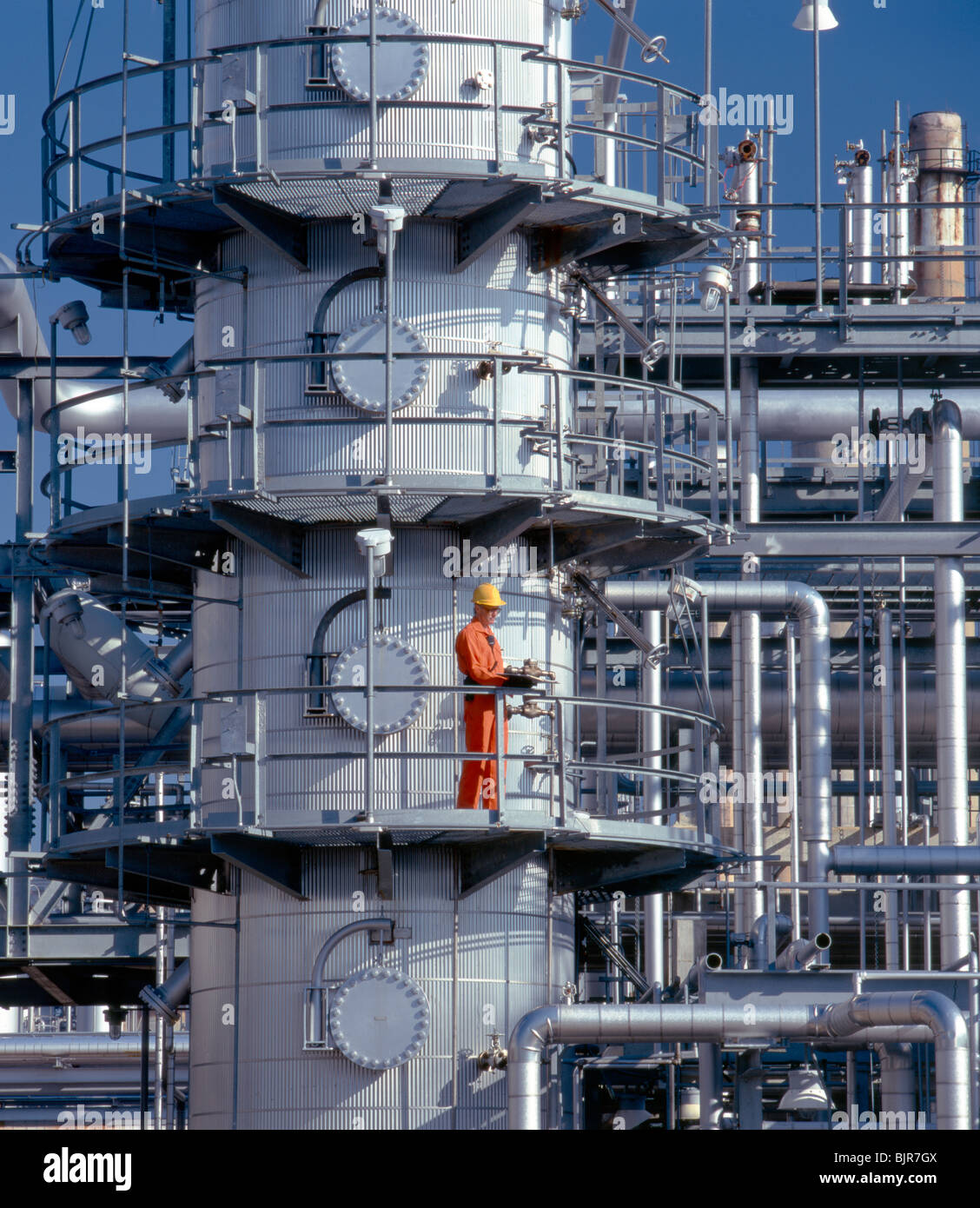 Worker at an oil refinery in Delaware, USA Stock Photo - Alamy