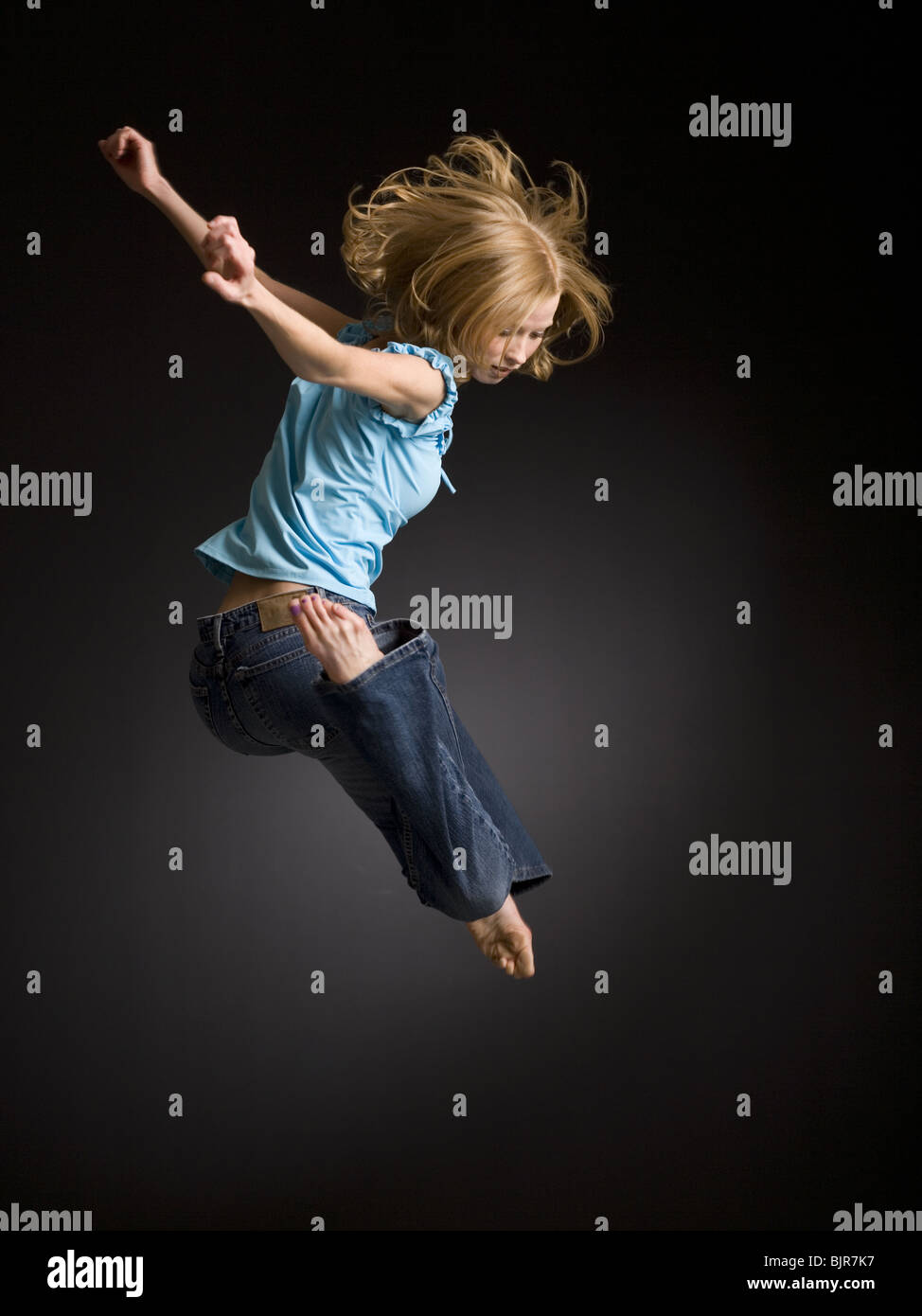 Person leaping in the air Stock Photo - Alamy