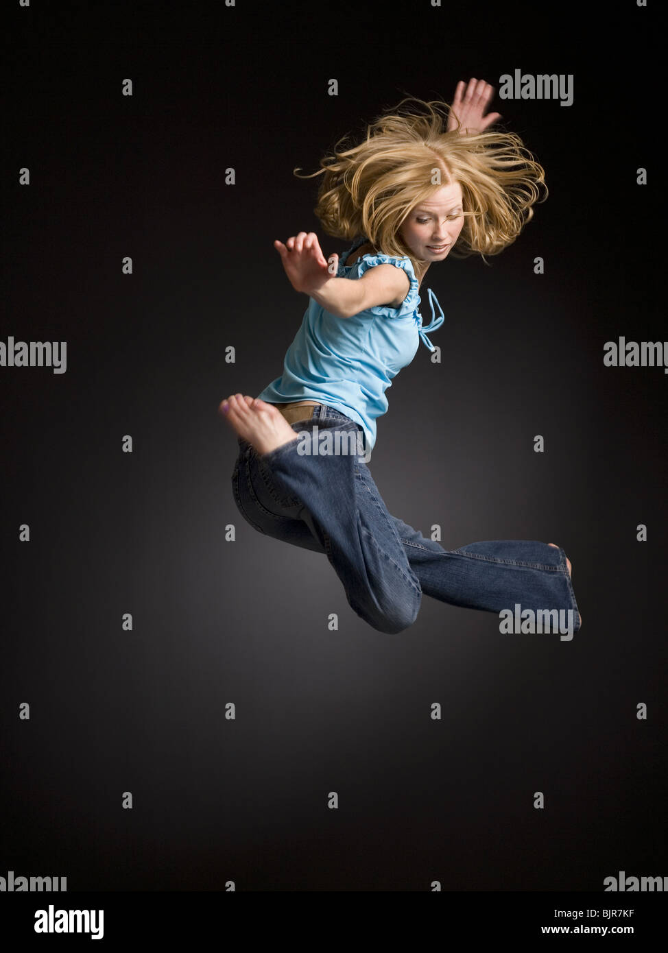 Person leaping in the air Stock Photo - Alamy