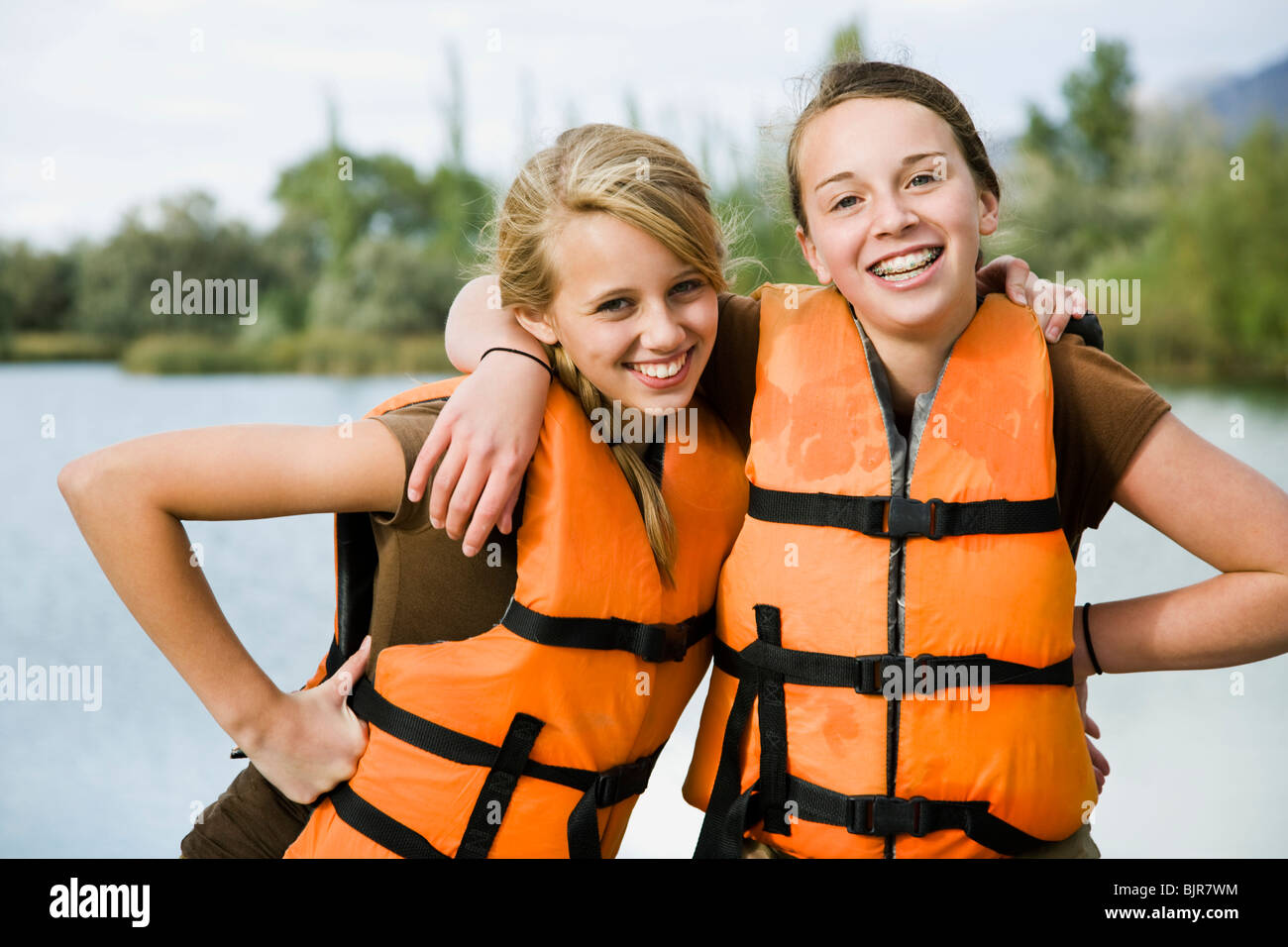 two girls in life vests Stock Photo - Alamy
