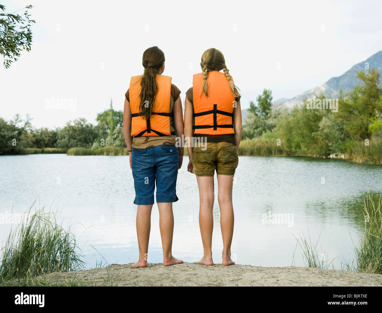 two girls in life vests Stock Photo - Alamy