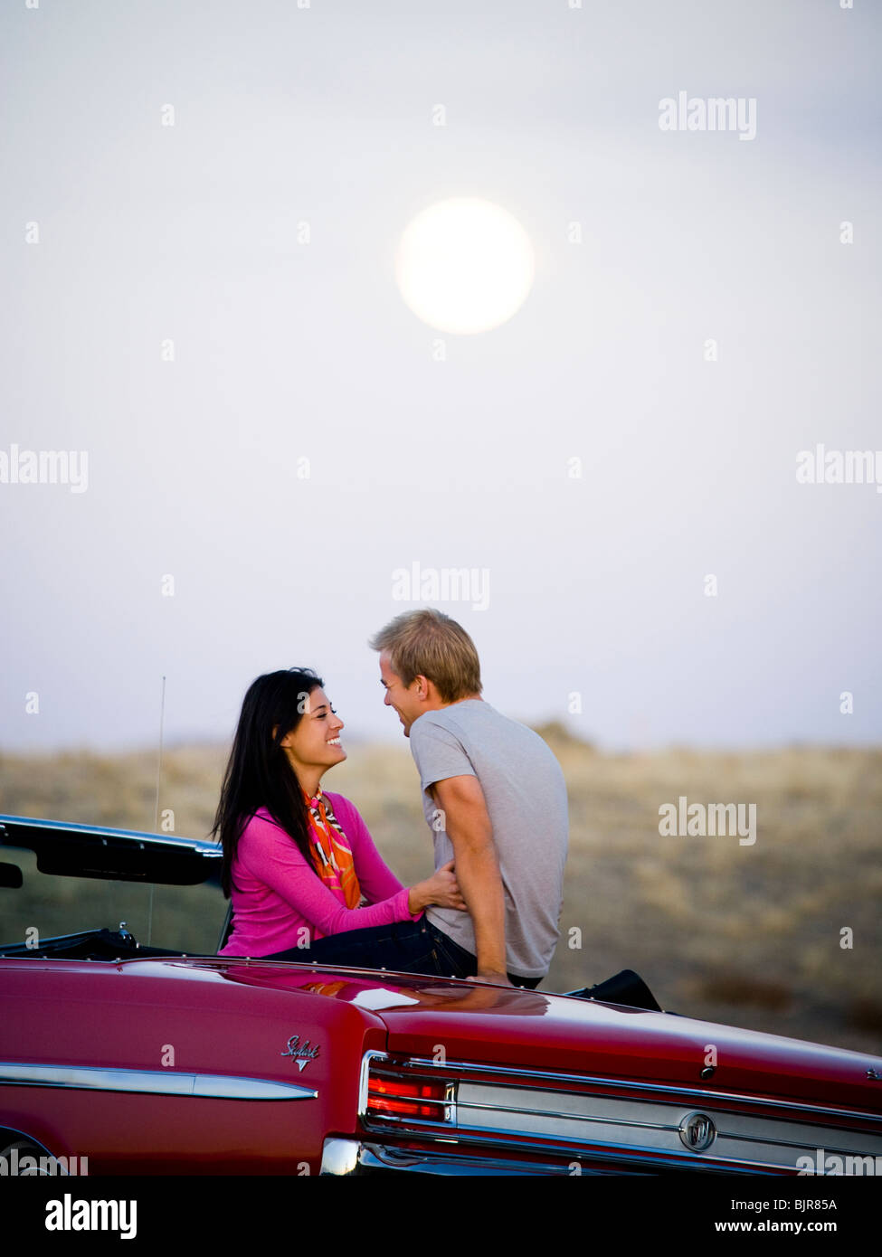 couple under a full moon Stock Photo - Alamy