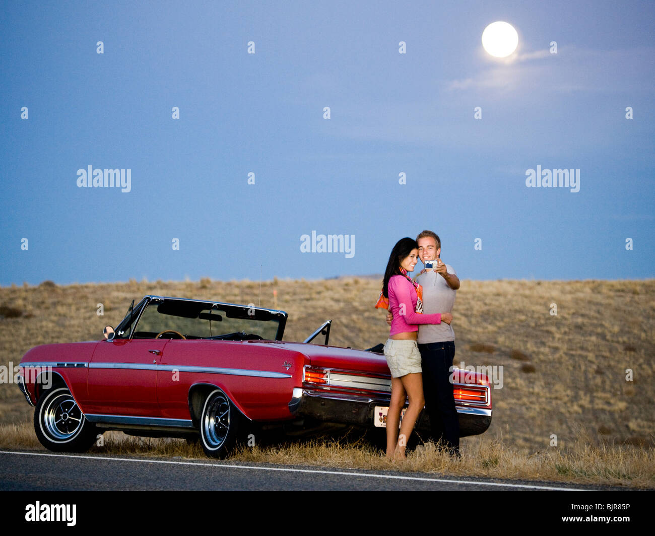 couple under a full moon Stock Photo - Alamy