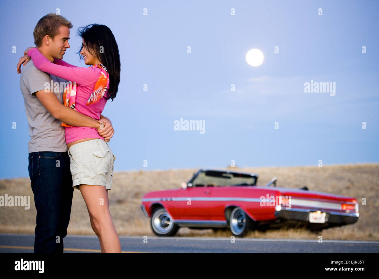 couple under a full moon Stock Photo - Alamy