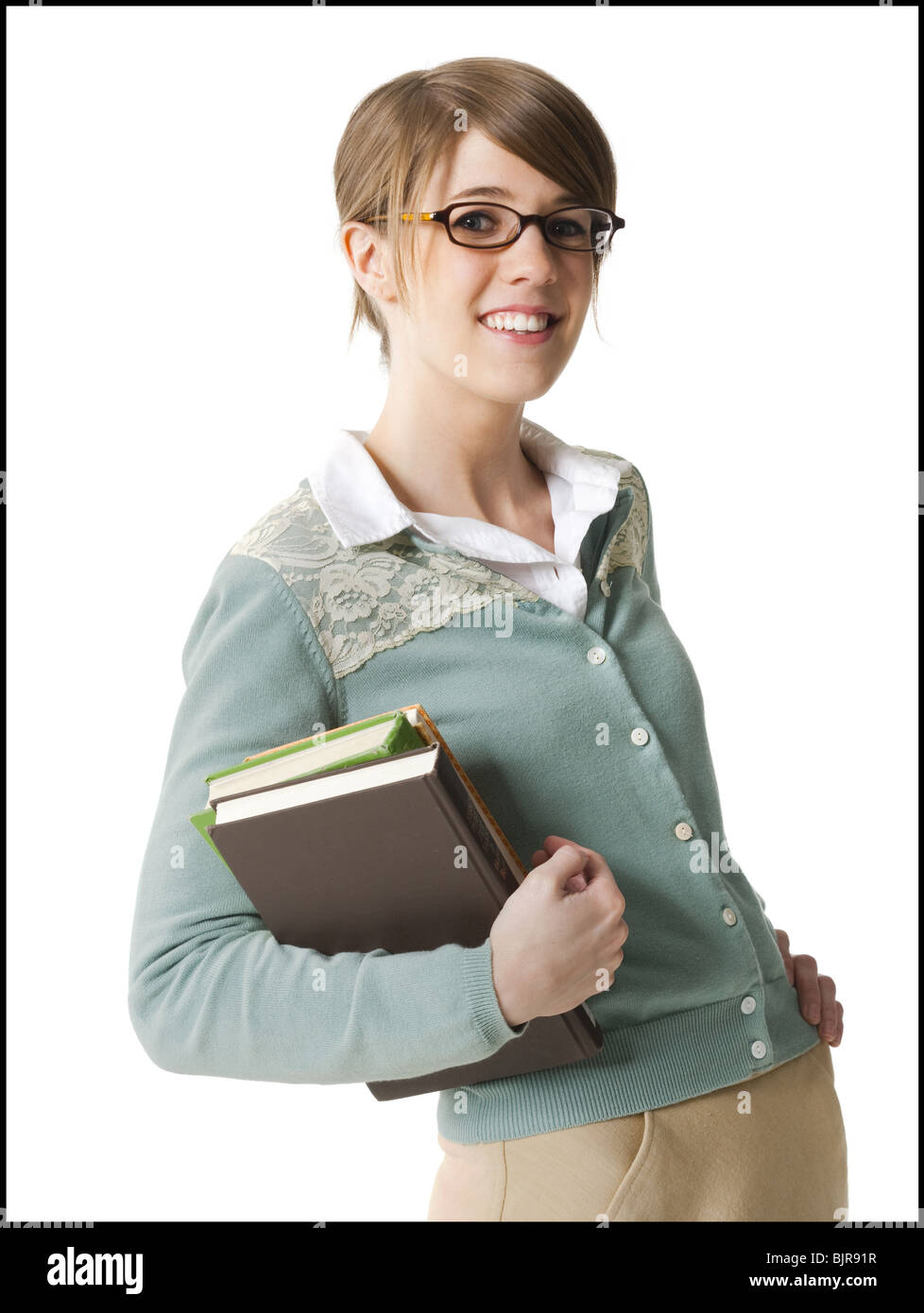 Young woman posing with books Stock Photo - Alamy