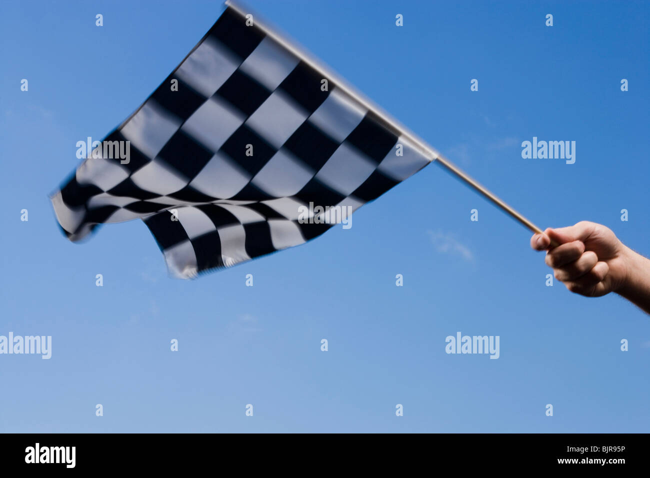 checkered flag being waved Stock Photo - Alamy