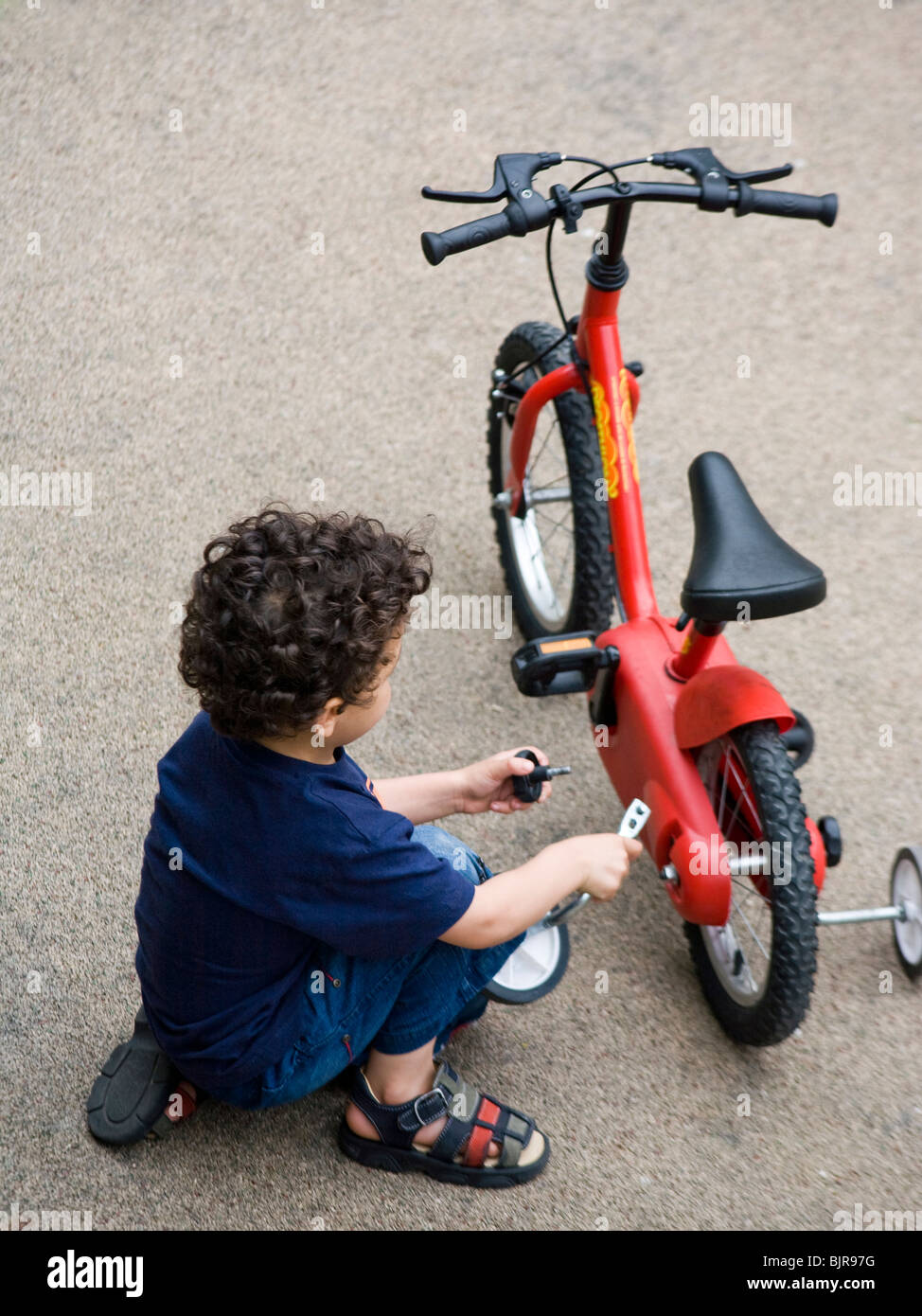 boy fixing his bike Stock Photo - Alamy