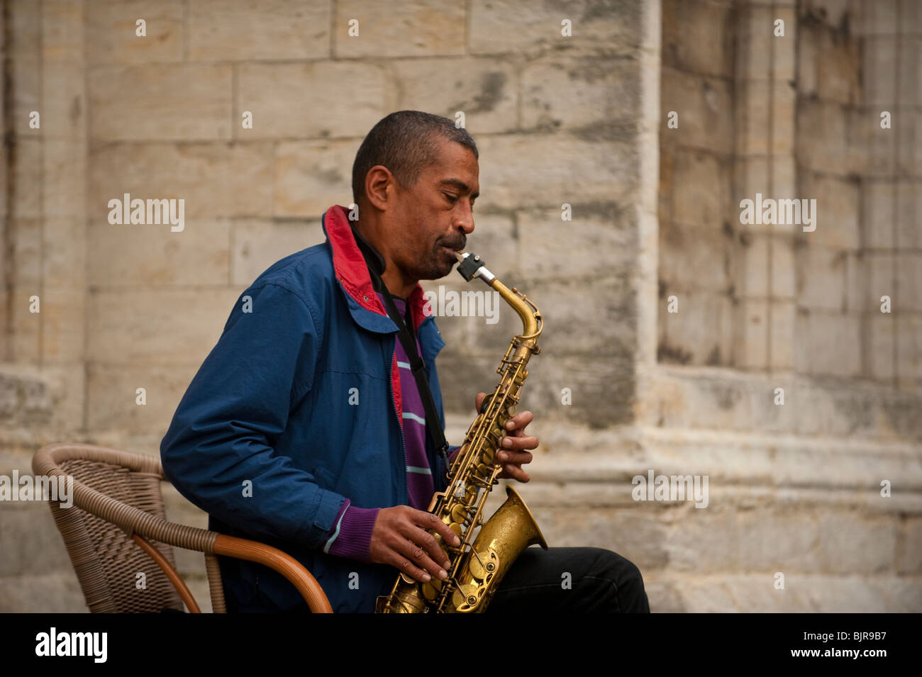 This is an image of a street performer playing the saxophone Stock ...