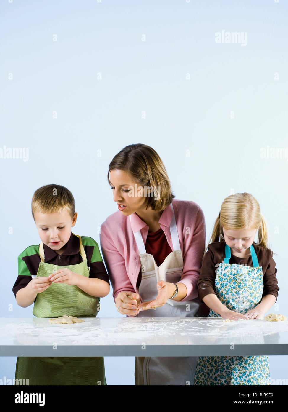 mother cooking with children Stock Photo - Alamy