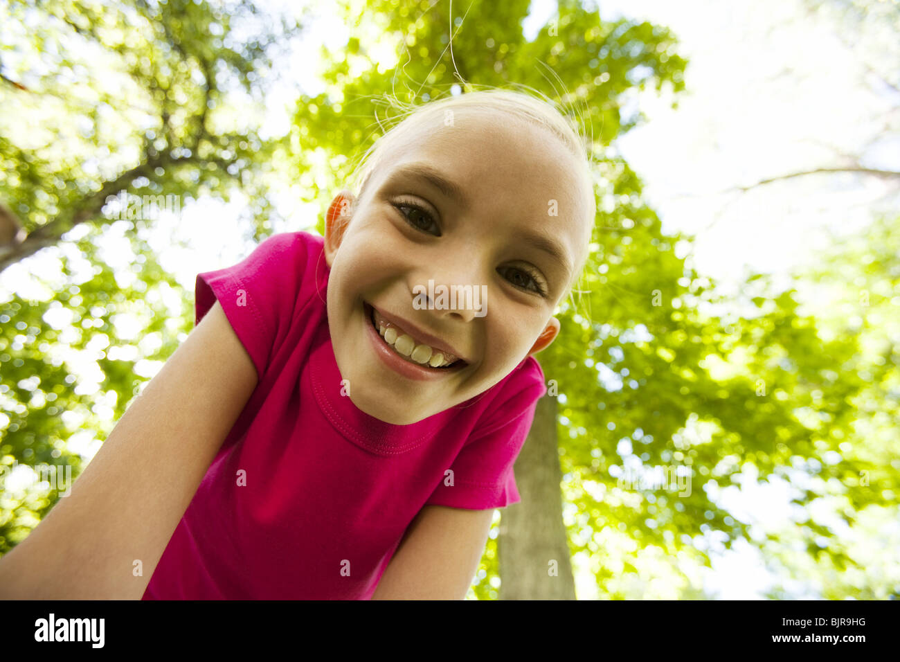 Girl smiling at camera Stock Photo - Alamy