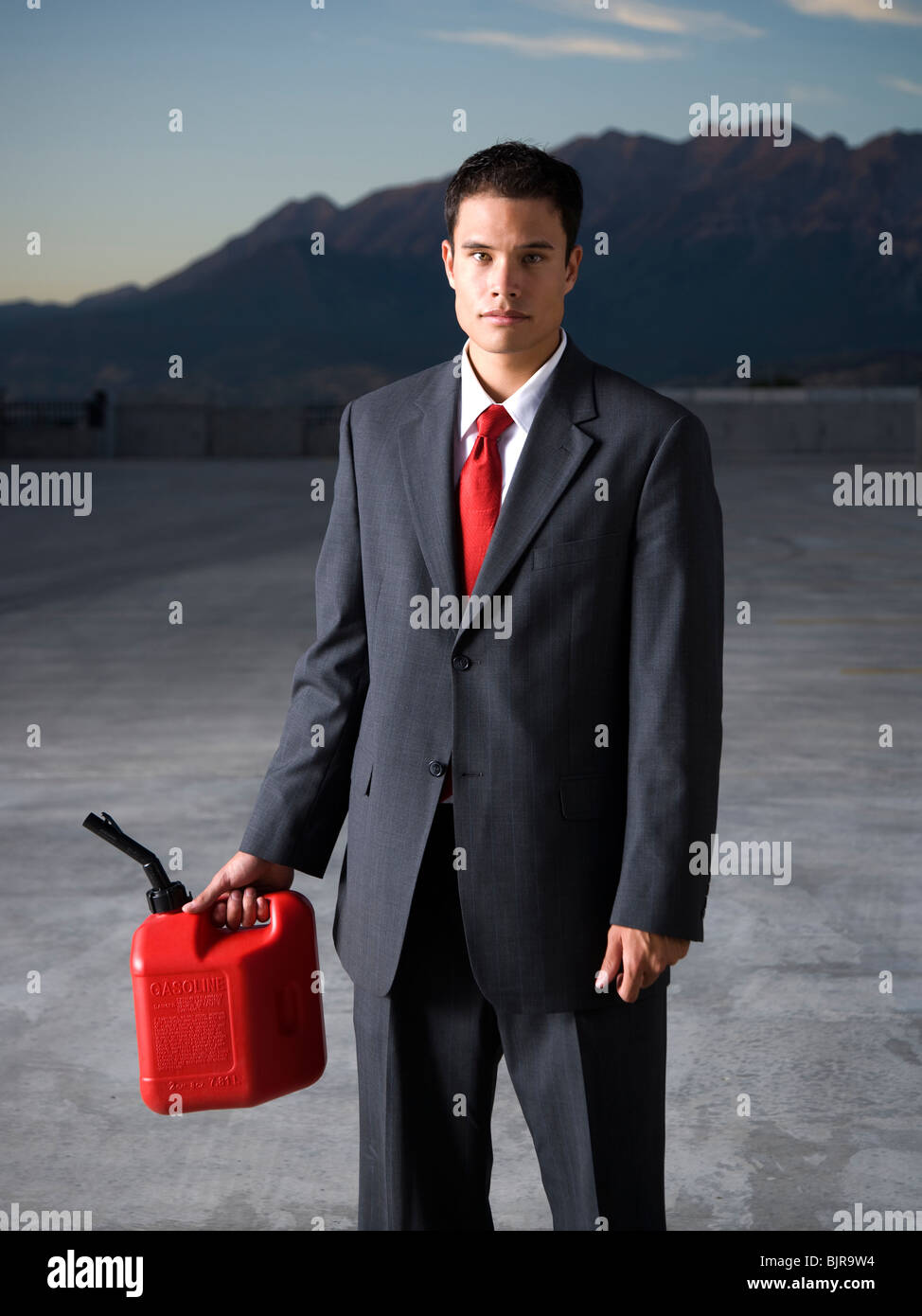 man in a suit with a gas can Stock Photo - Alamy