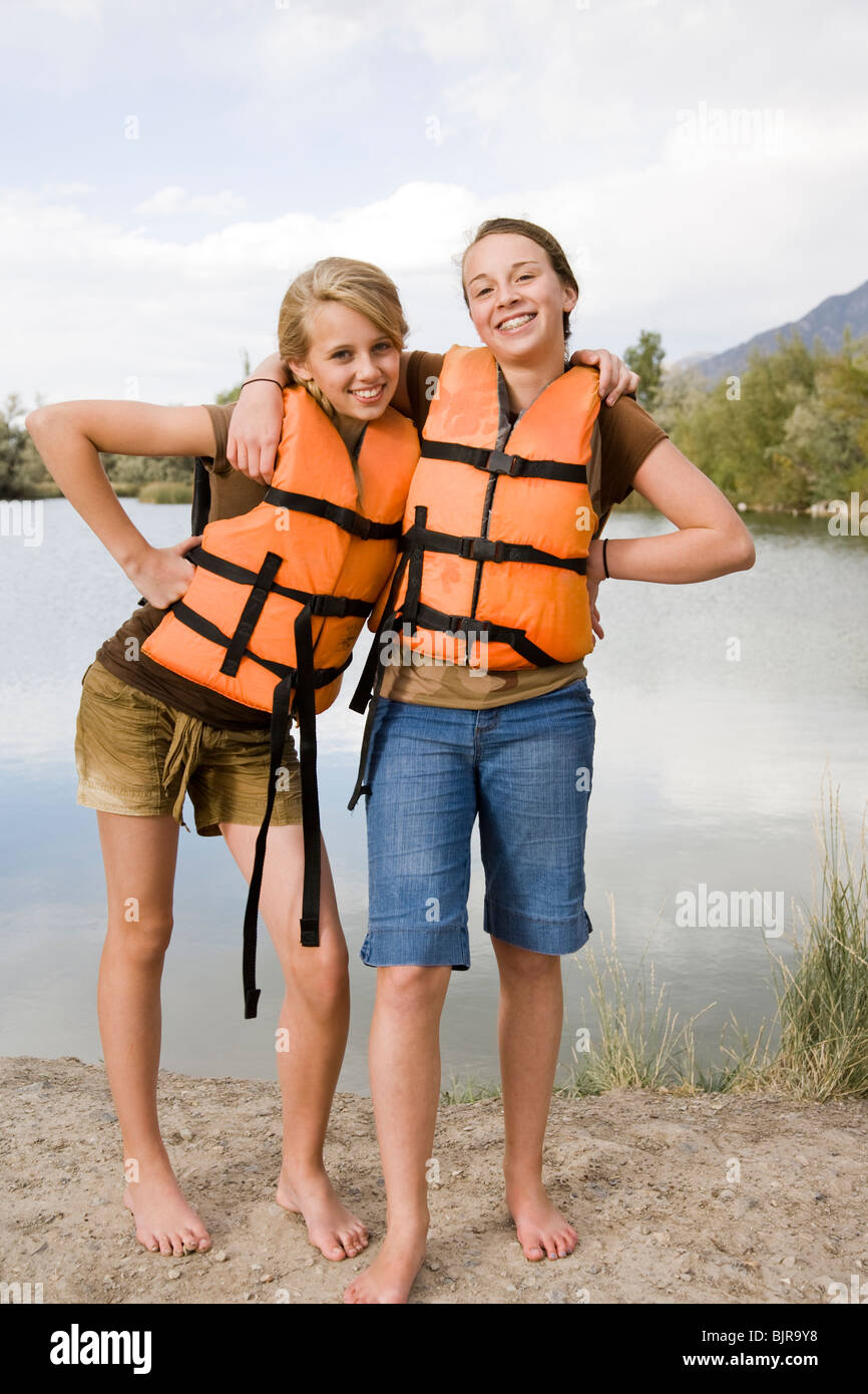 two girls in life vests Stock Photo - Alamy