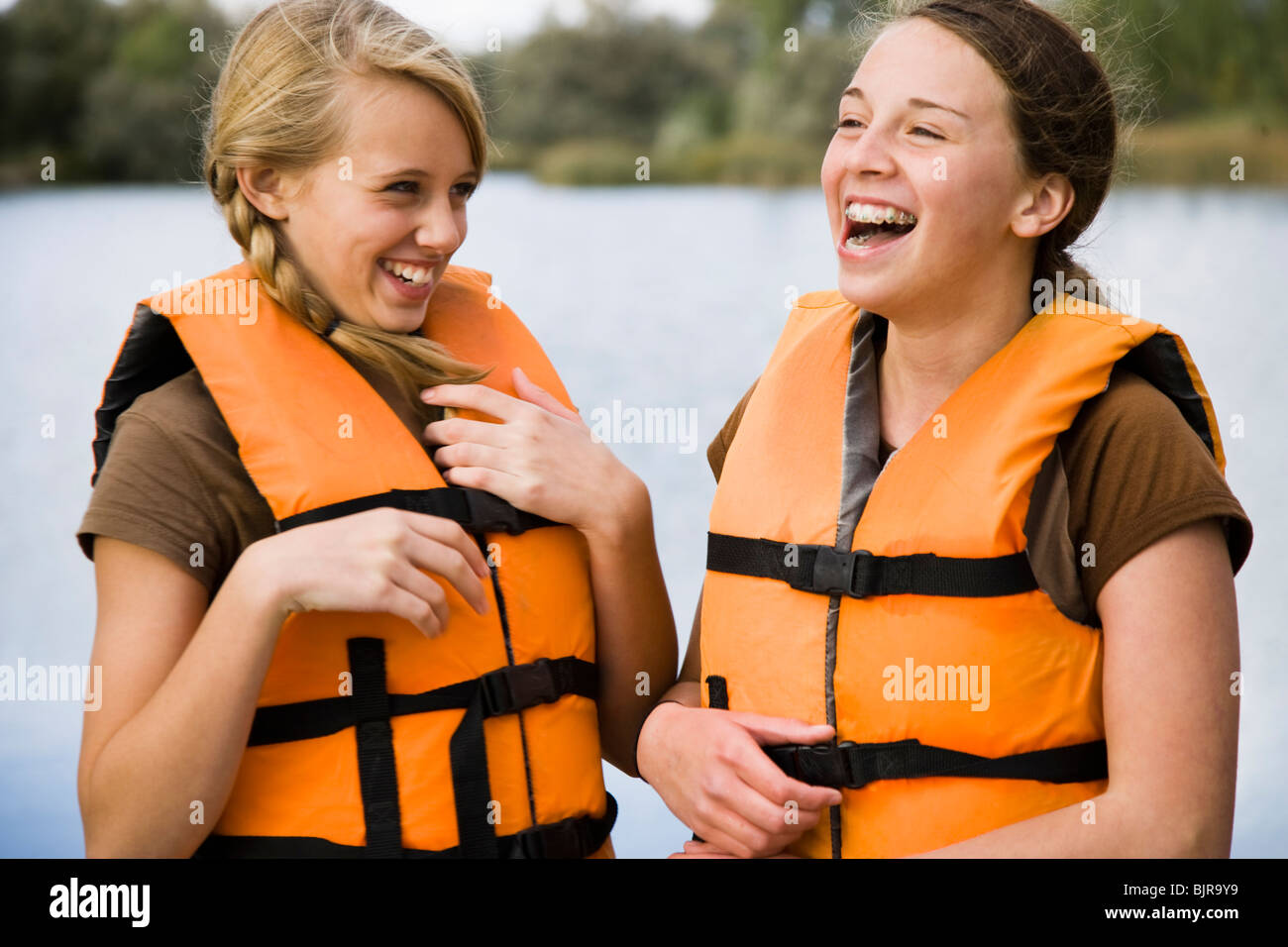 two girls in life vests Stock Photo - Alamy