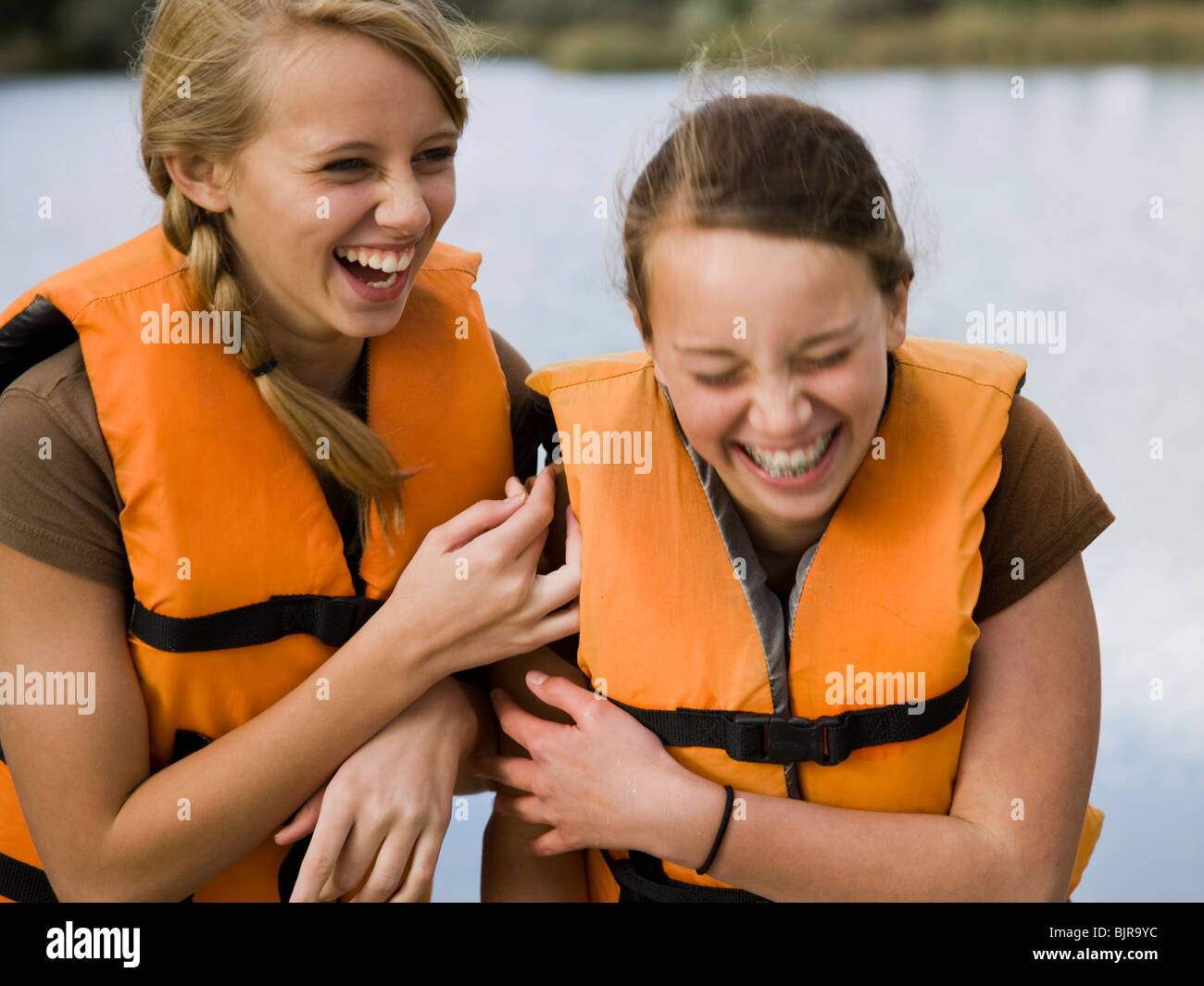 two girls in life vests Stock Photo - Alamy