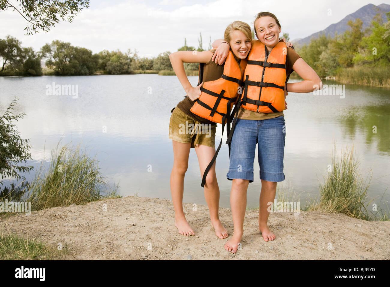 two girls in life vests Stock Photo - Alamy