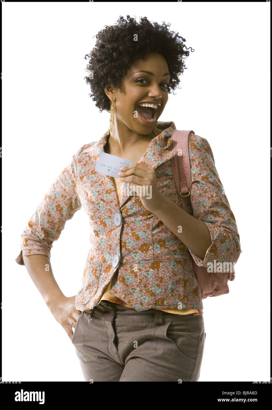 Woman posing and smiling with hand on hip Stock Photo - Alamy