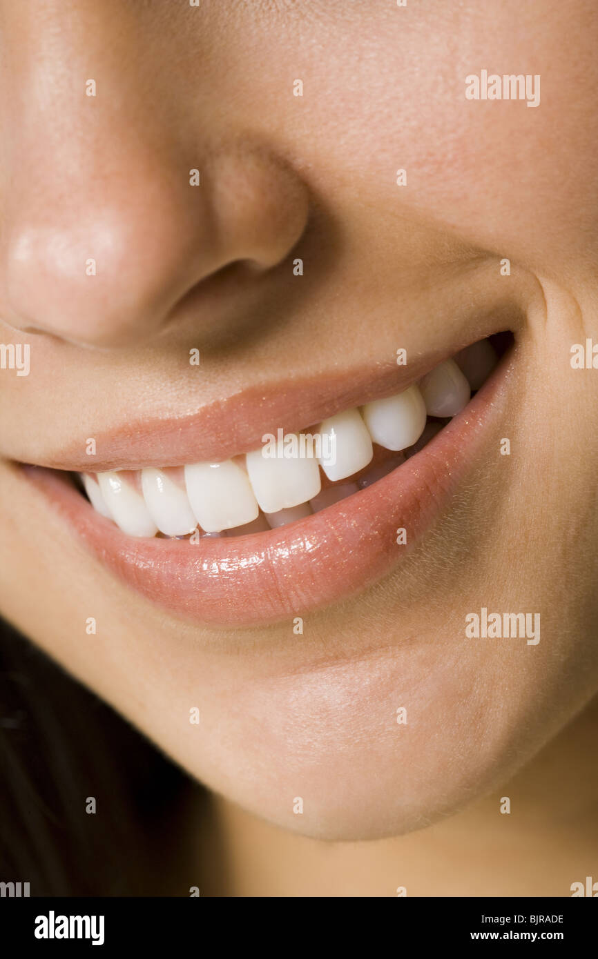 Woman posing and smiling Stock Photo - Alamy