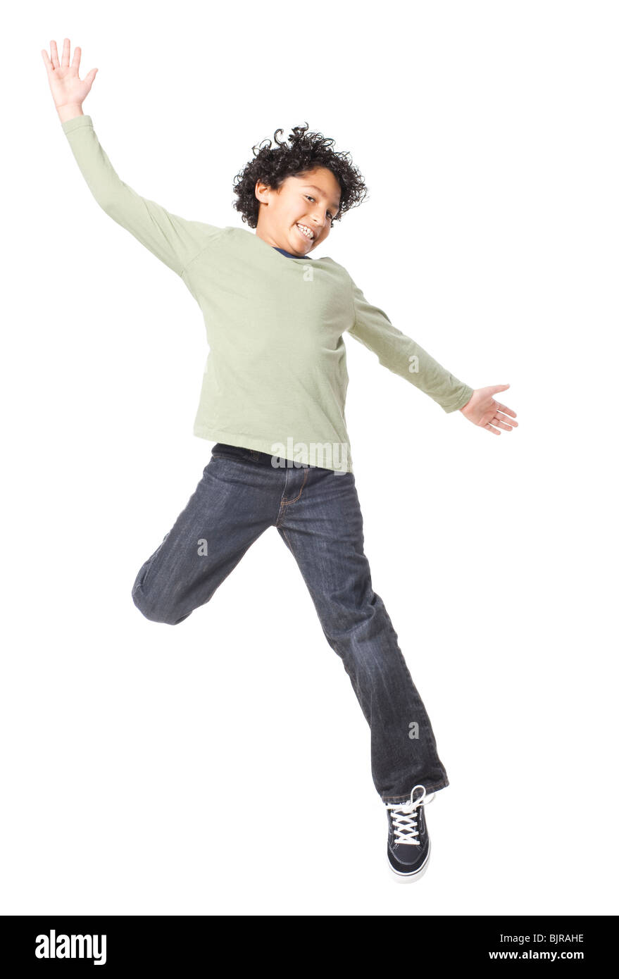 Boy (8-9) jumping, against white background Stock Photo - Alamy