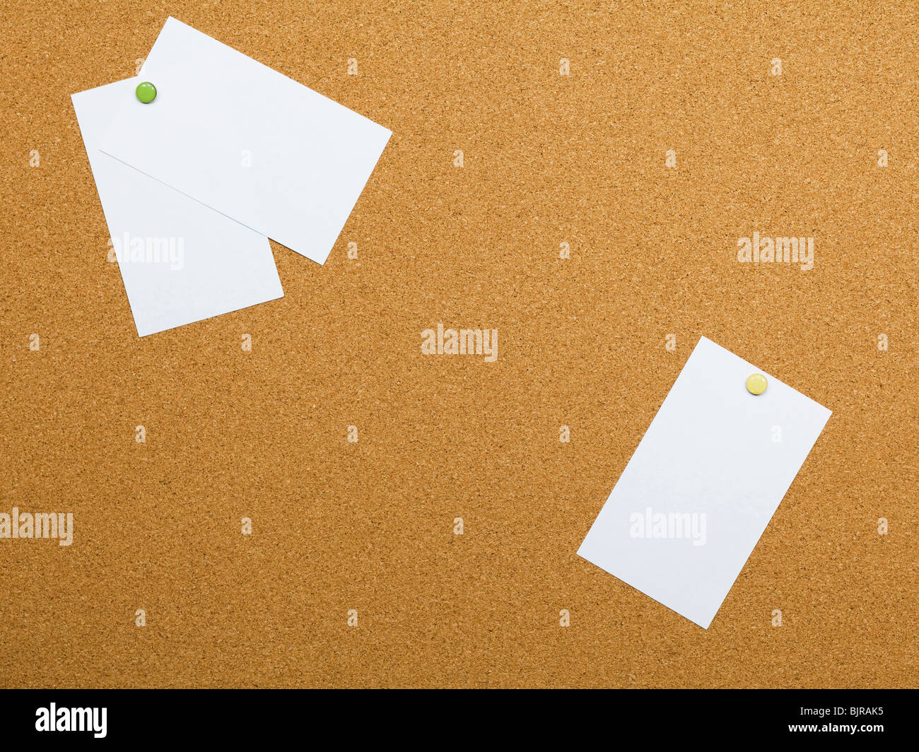 Three blank papers pinned to notice board Stock Photo - Alamy