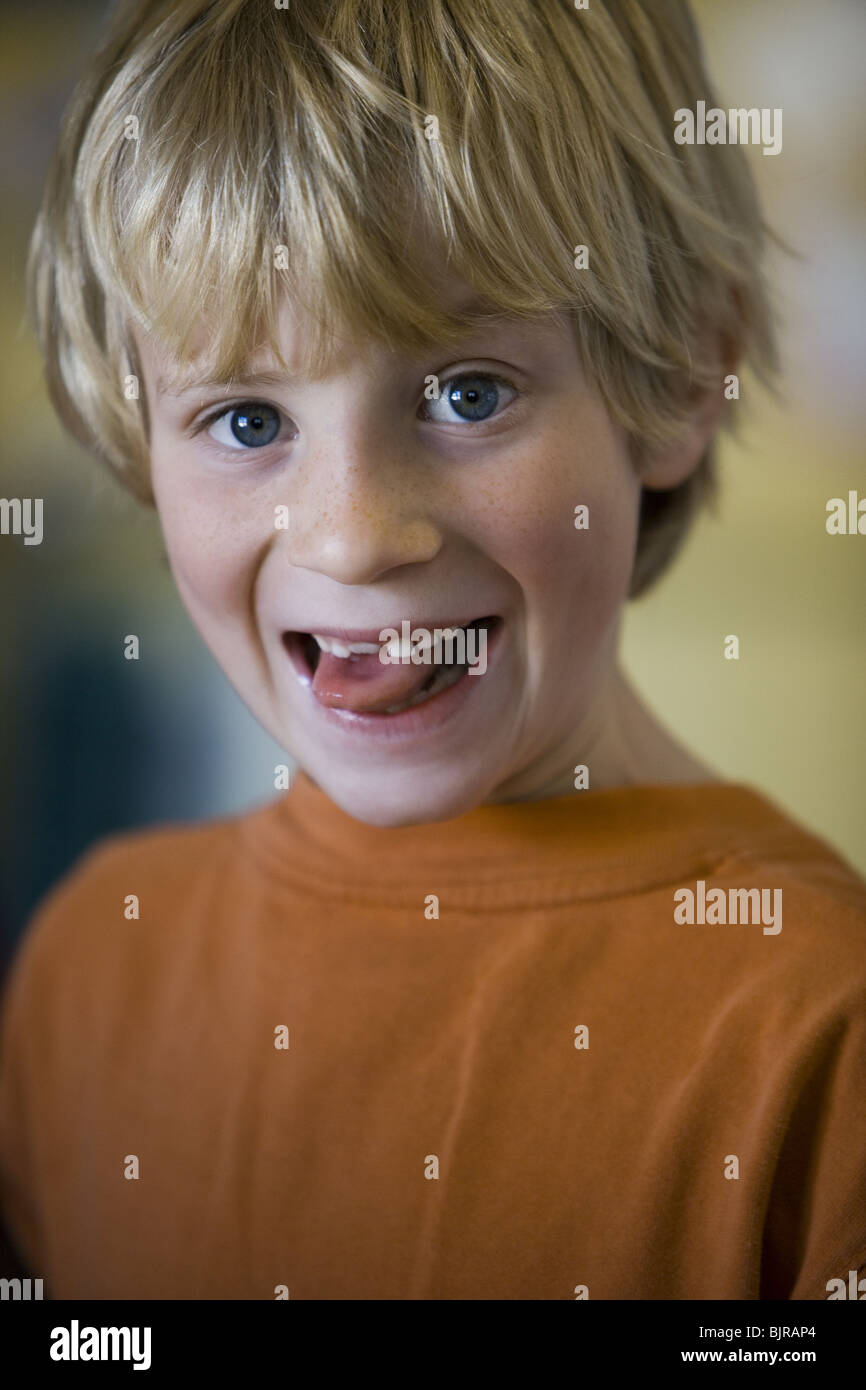 Boy posing with apprehensive look Stock Photo - Alamy