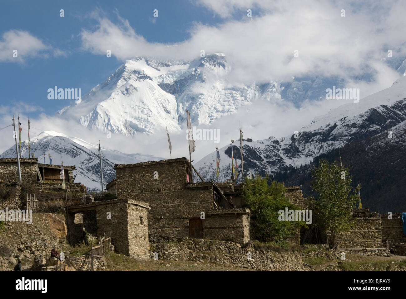 Houses and prayer flags, village, Manang, Annapurna Circuit, Nepal ...