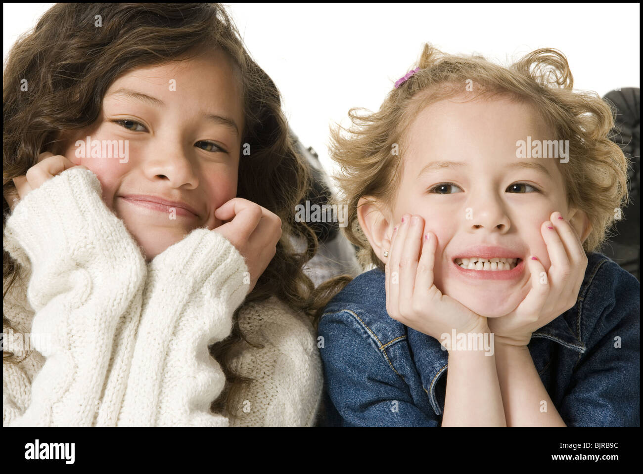 Sisters posing and smiling Stock Photo - Alamy