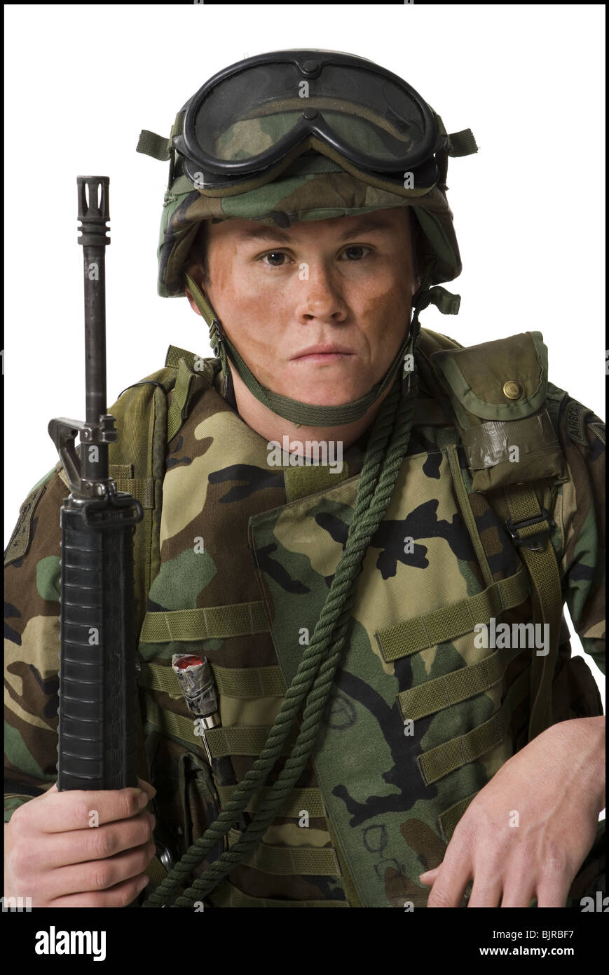 Soldier posing with weapon Stock Photo - Alamy