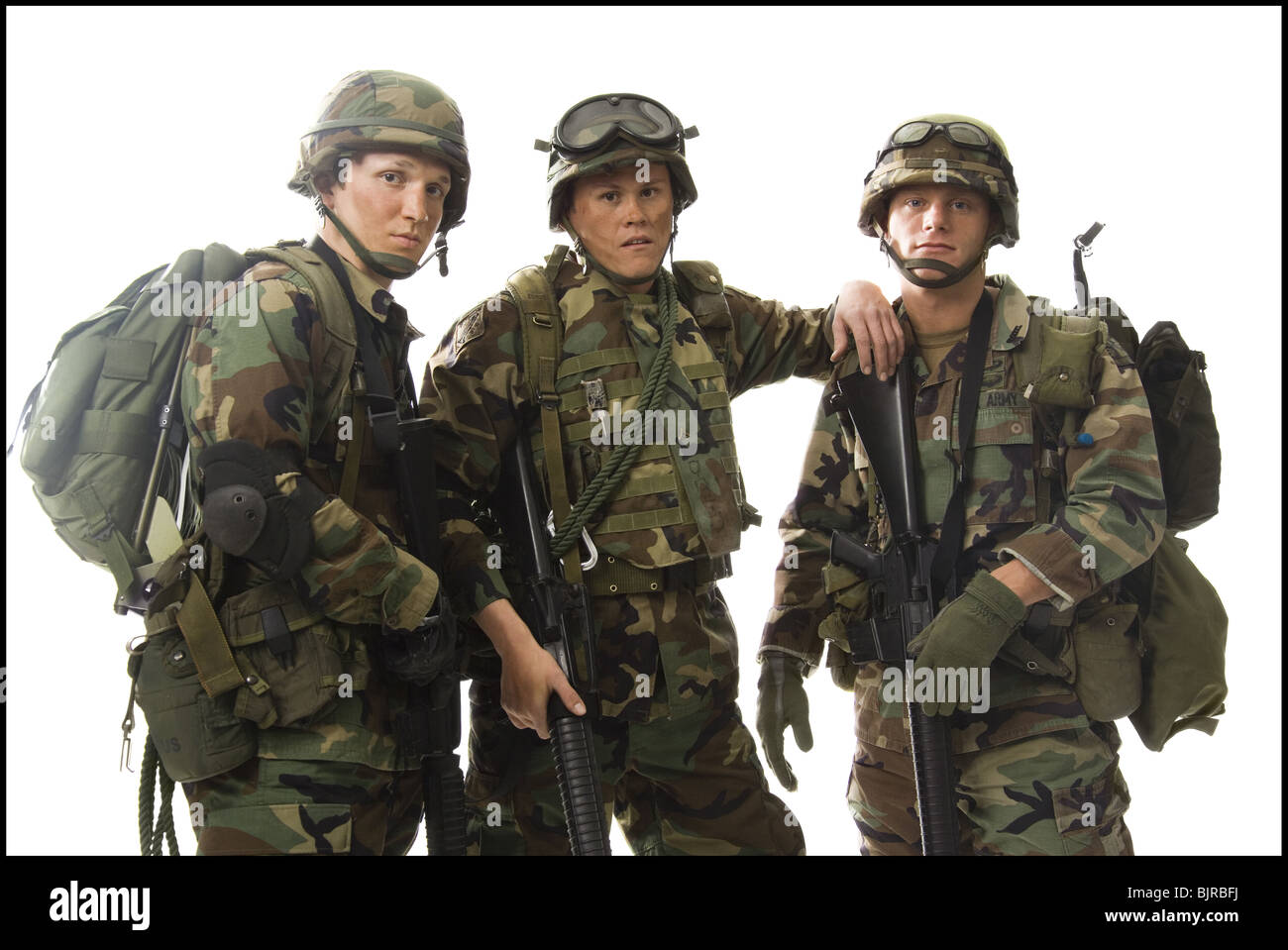 Soldiers posing with weapons Stock Photo - Alamy