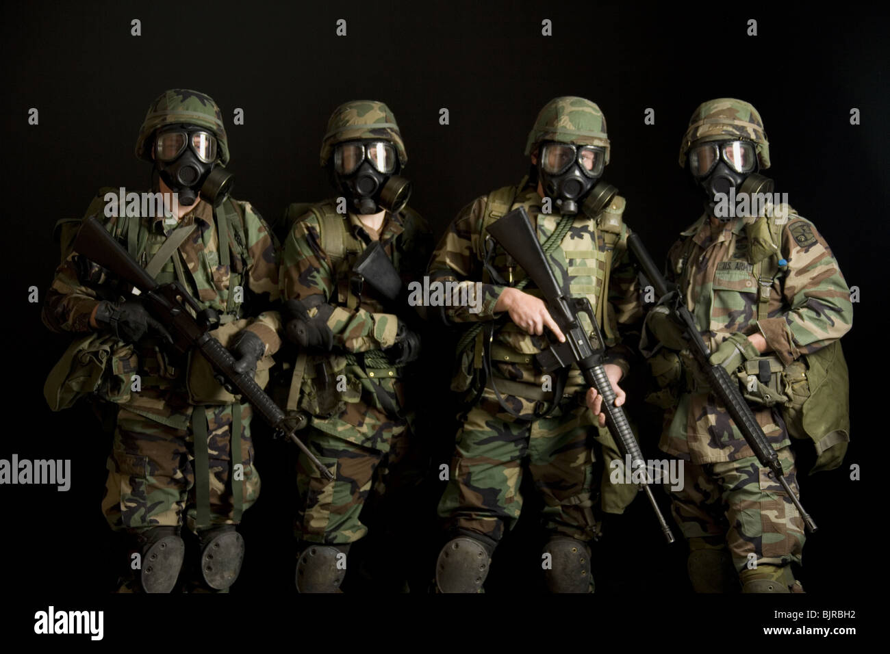 Two soldiers posing with gas masks Stock Photo - Alamy