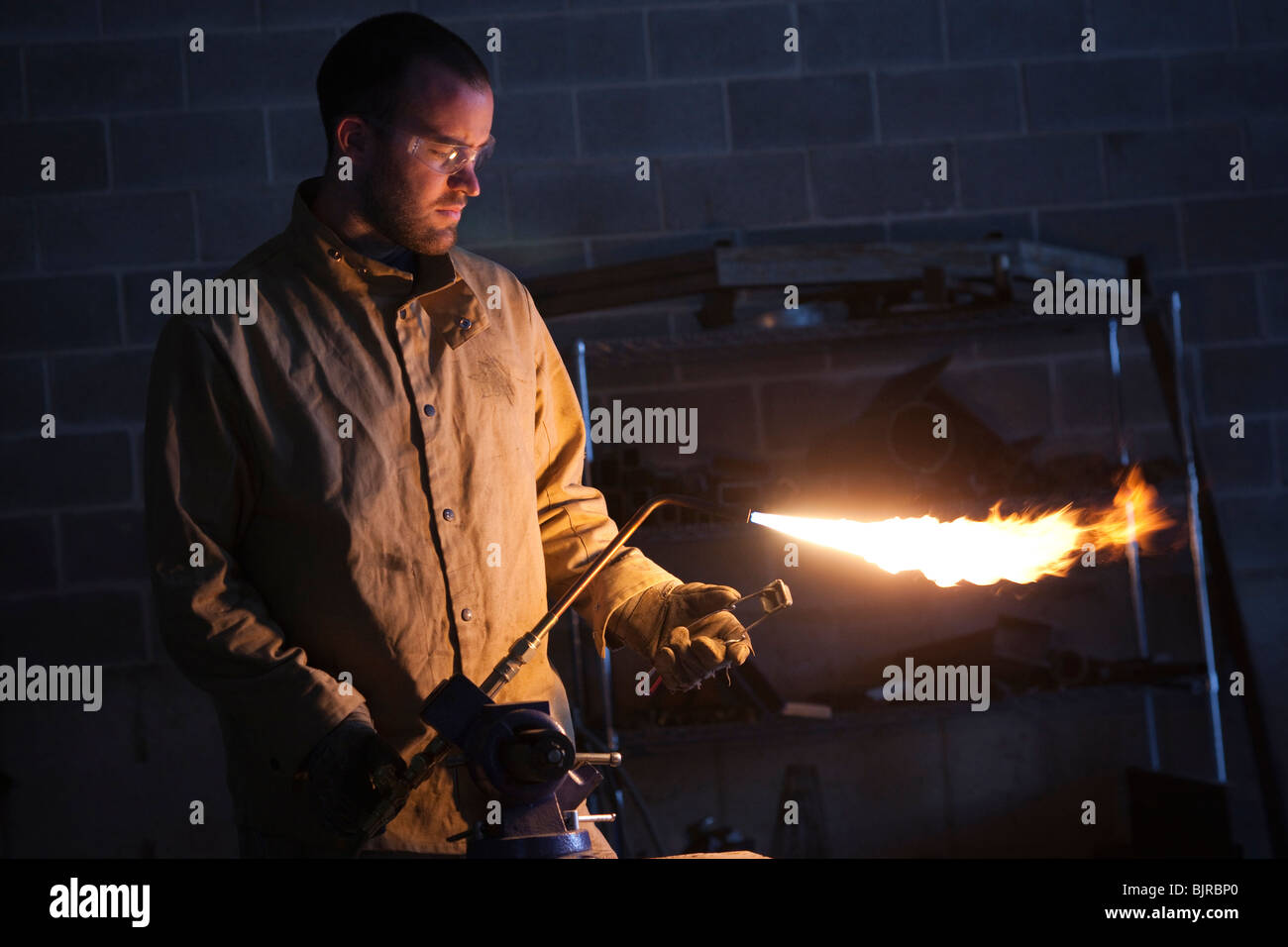 Man using blowtorch in manufacturing hi-res stock photography and ...