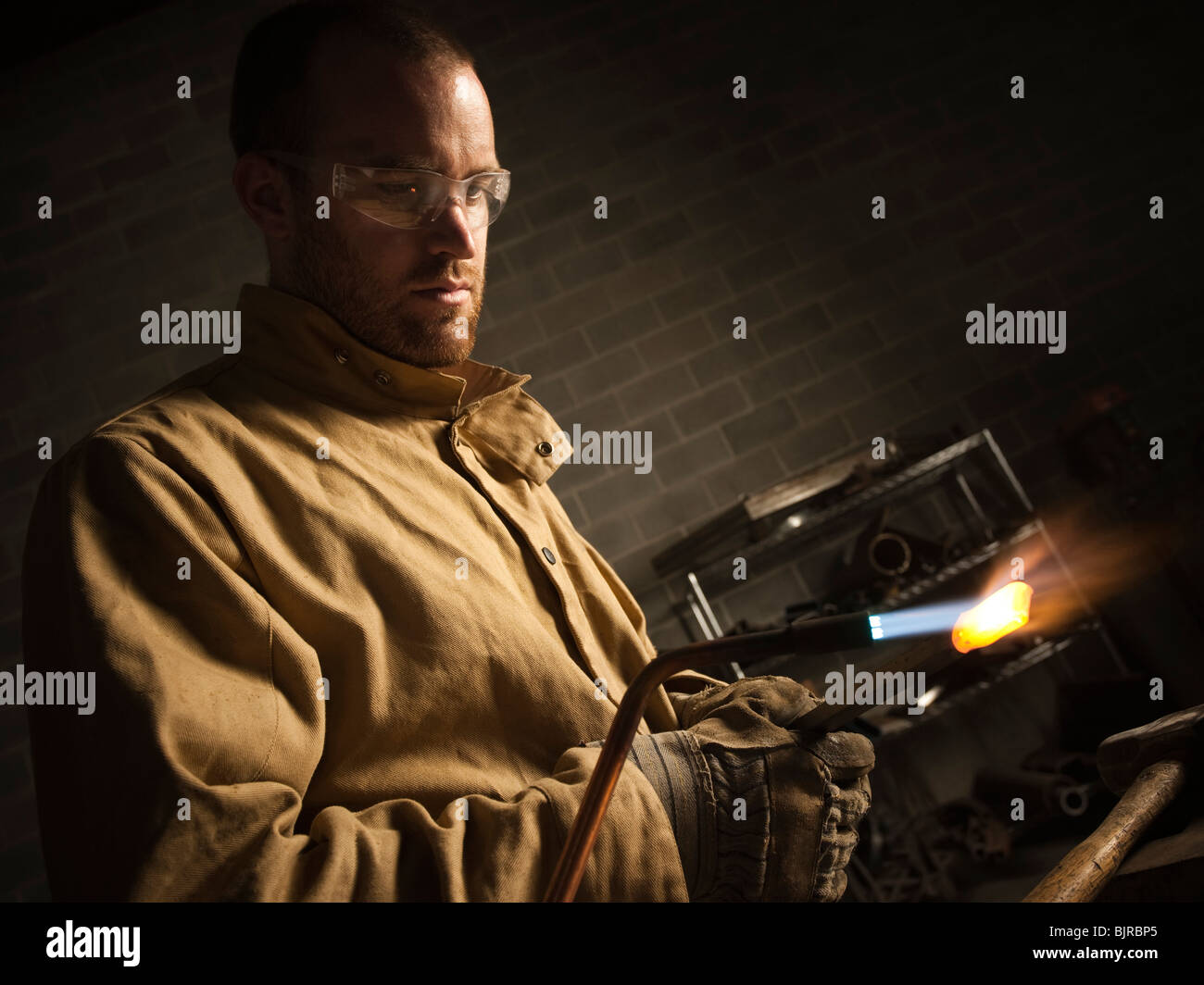 Man using blowtorch in manufacturing hi-res stock photography and ...