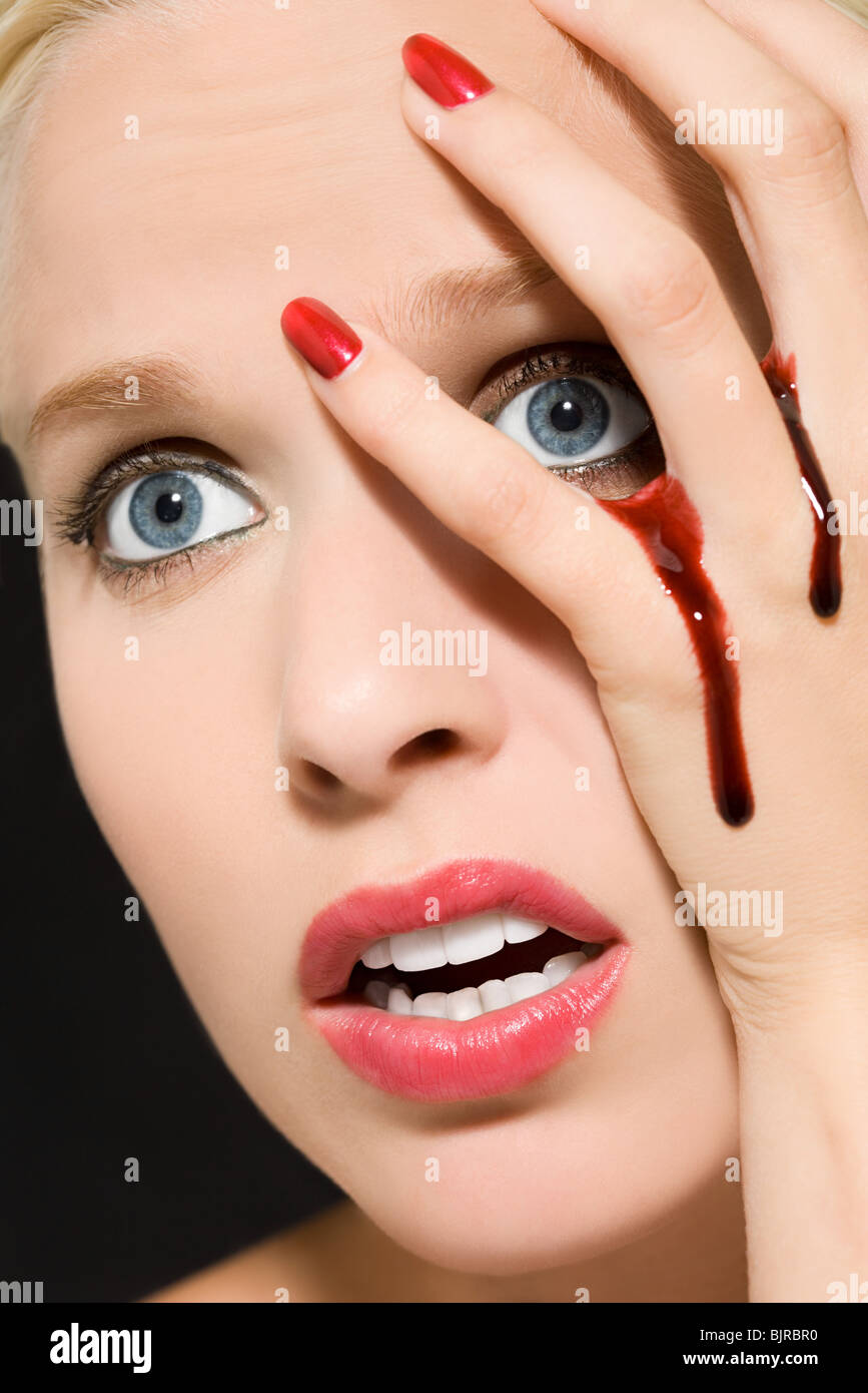 Woman with blood on her hands Stock Photo - Alamy
