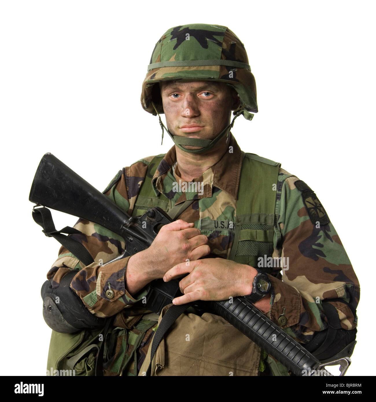 Soldier posing with weapon Stock Photo - Alamy