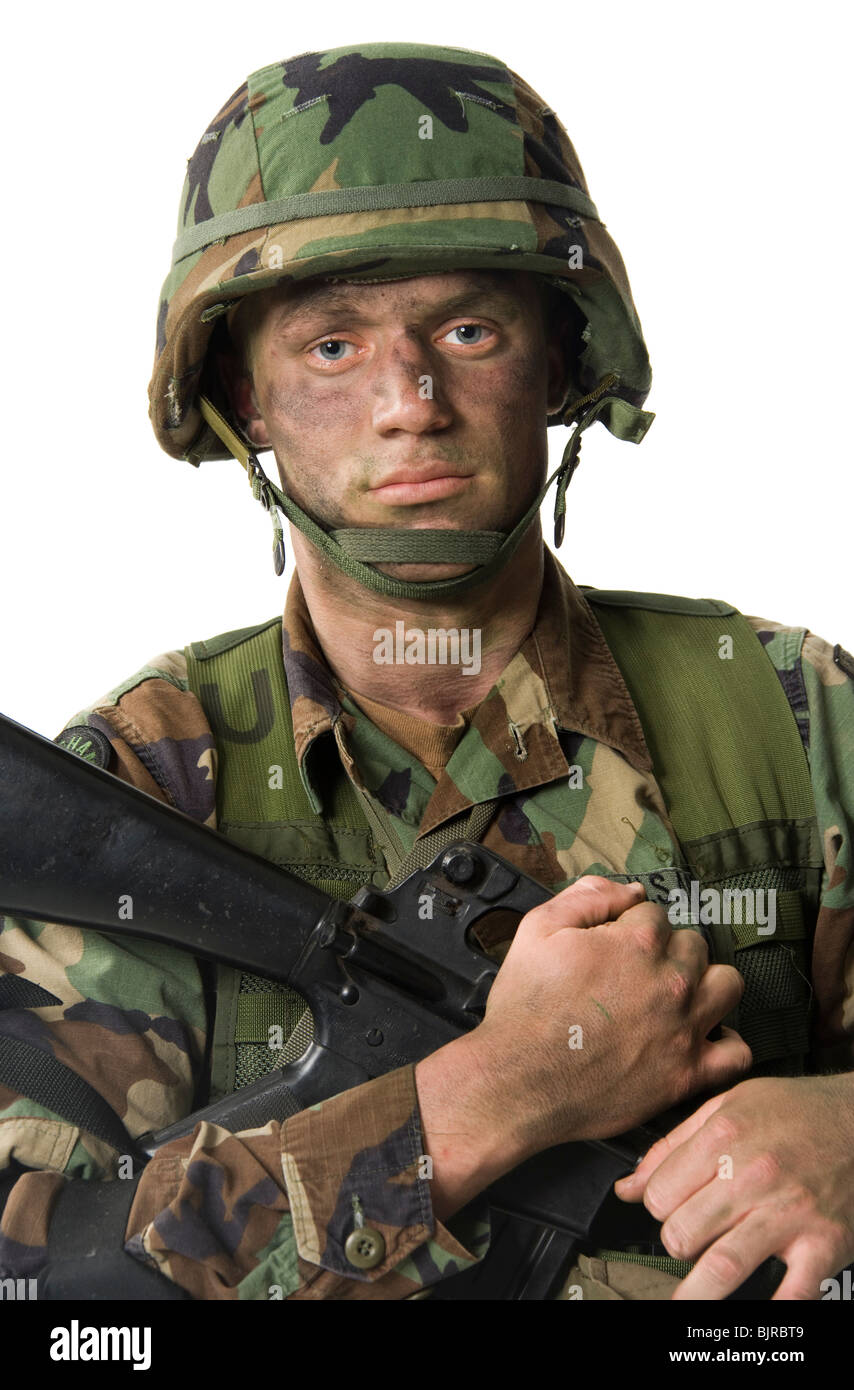 Soldier posing with weapon Stock Photo - Alamy