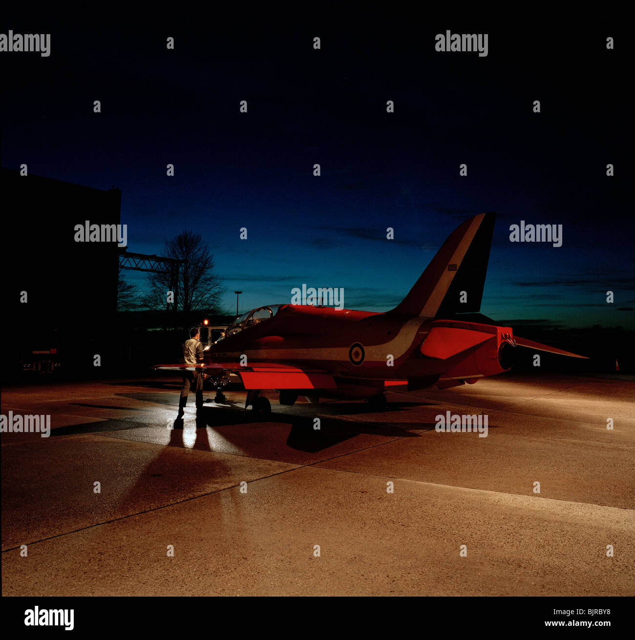 A Red Arrows Hawk is refuelled after maintenance outside an MoD hangar ...