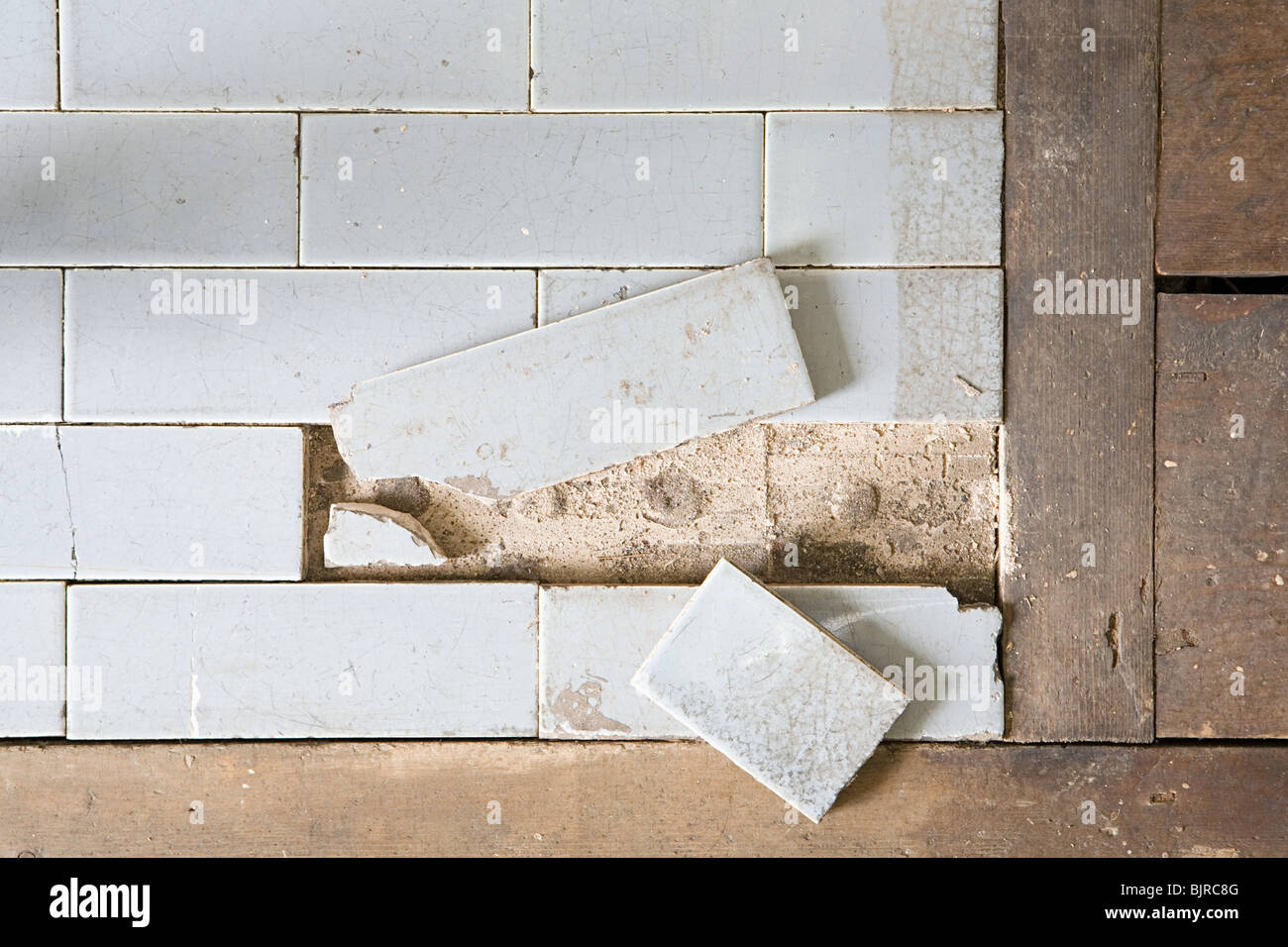Broken floor tiles Stock Photo - Alamy